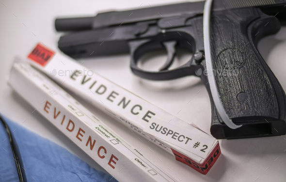 Sealed gun in crime lab next to DNA evidence, crime investigation ...