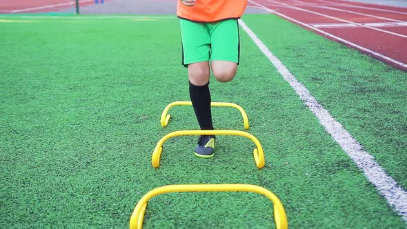 Football Player Doing Football Exercises with Overcoming Obstacles ...