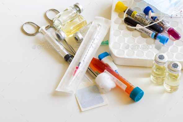 Diagnostic laboratory table with blood test samples and other equipment ...