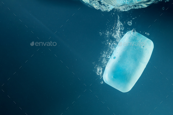 Bar of soap dropped in the water creating a splash - beating ...