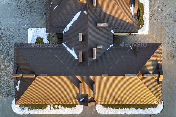 Top aerial view of building brown shingle tiled roof with complex ...