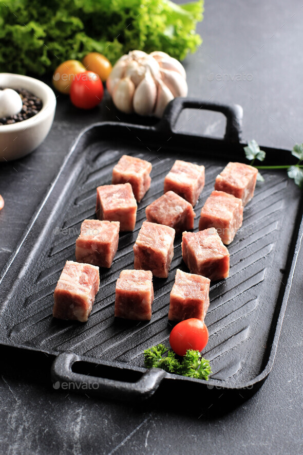 Raw Frozen Saikoro Wagyu Cubes or Dice Beef Steak on Black Steak Plate ...