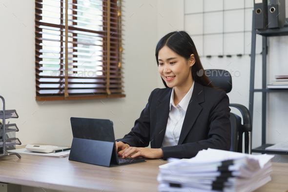 Secretary concept, Female secretary is working and typing report of ...