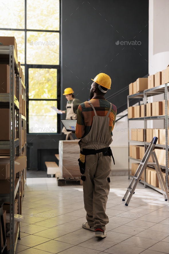 Storage room manager checking carton boxes with products Stock Photo by ...