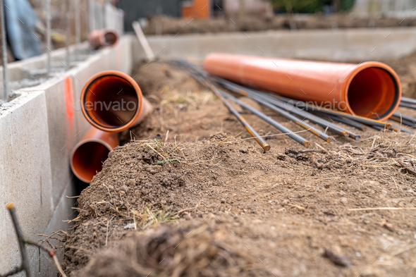plastic pipe for sewage network in the base plate at the construction ...