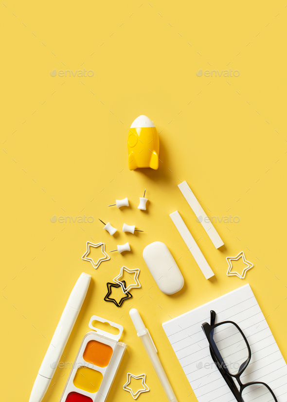 Back to school theme with white schools tools on yellow background ...
