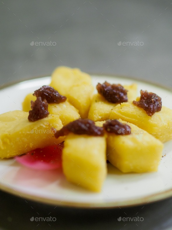chef hand wearing gloves preparing fried snacks to serve at finger food ...