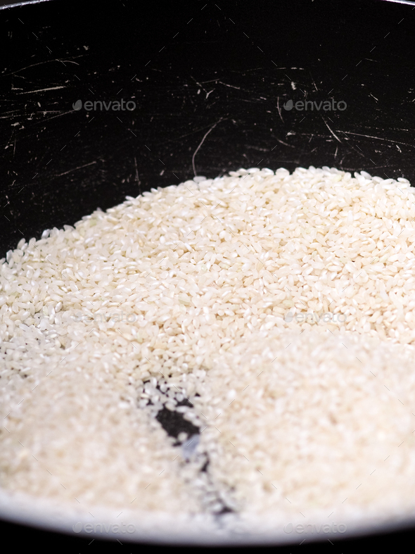 chef styr carnaroli rice on pan for risotto recipe dish Stock Photo by ...
