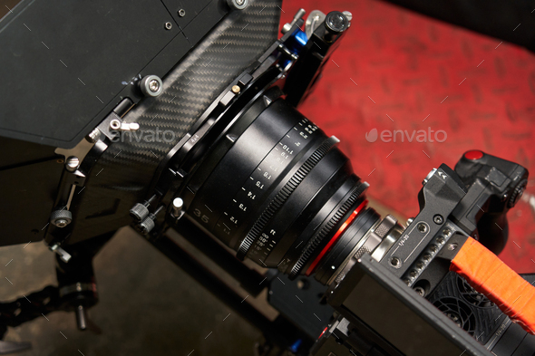 lens mounted on a professional film camera. The camera and anti-glare ...