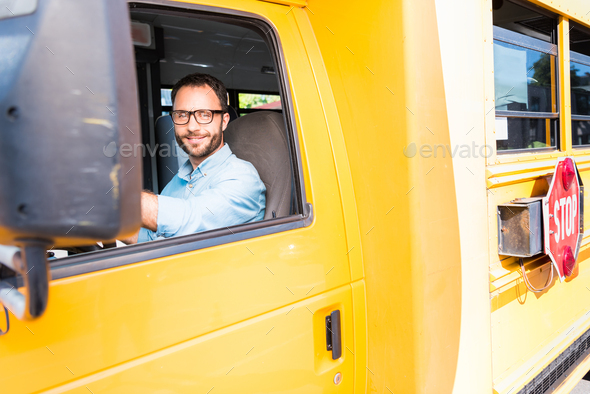 attractive happy school bus driver looking at camera Stock Photo by ...