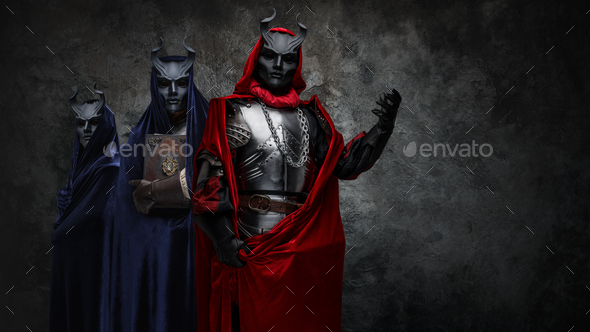 Dark cultists with robes and masks against dark background Stock Photo ...