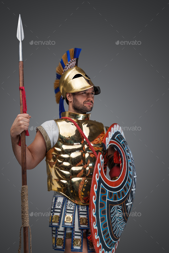 Greek fighter from past with spear and rounded shield Stock Photo by ...