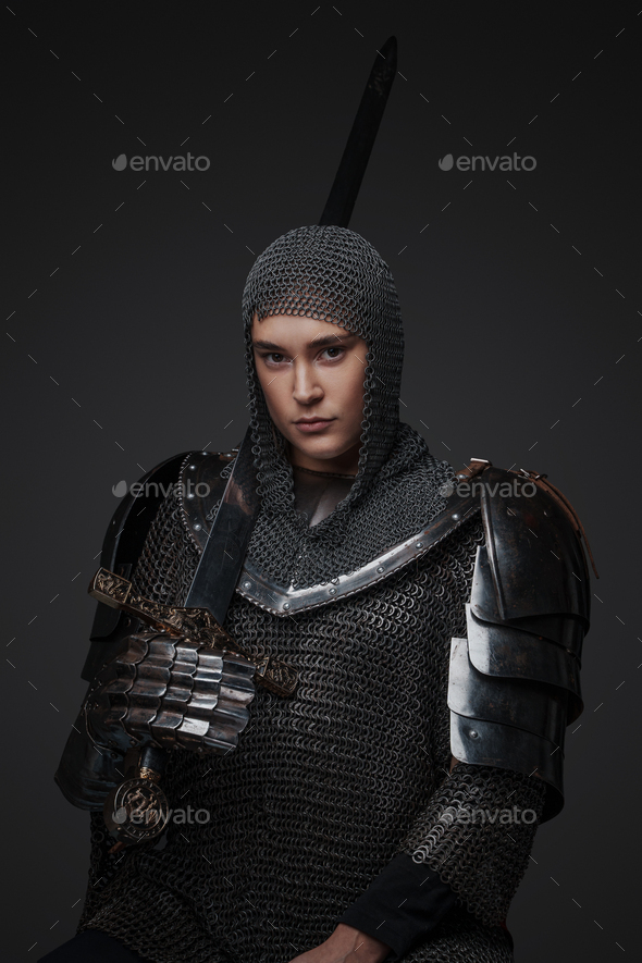 Knight woman from past with sword dressed in chainmail Stock Photo by ...