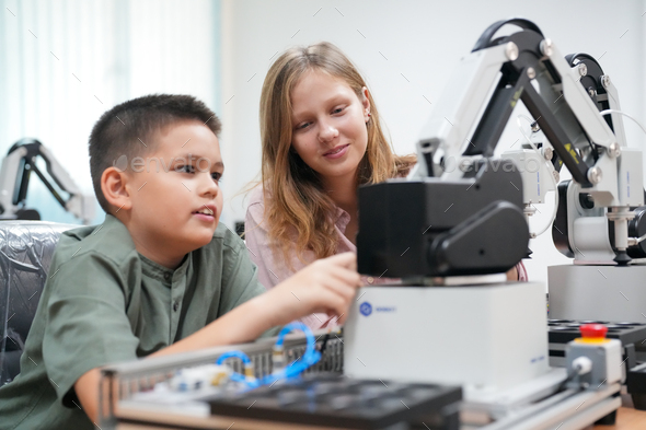 Children using technology, student working with robot for science ...