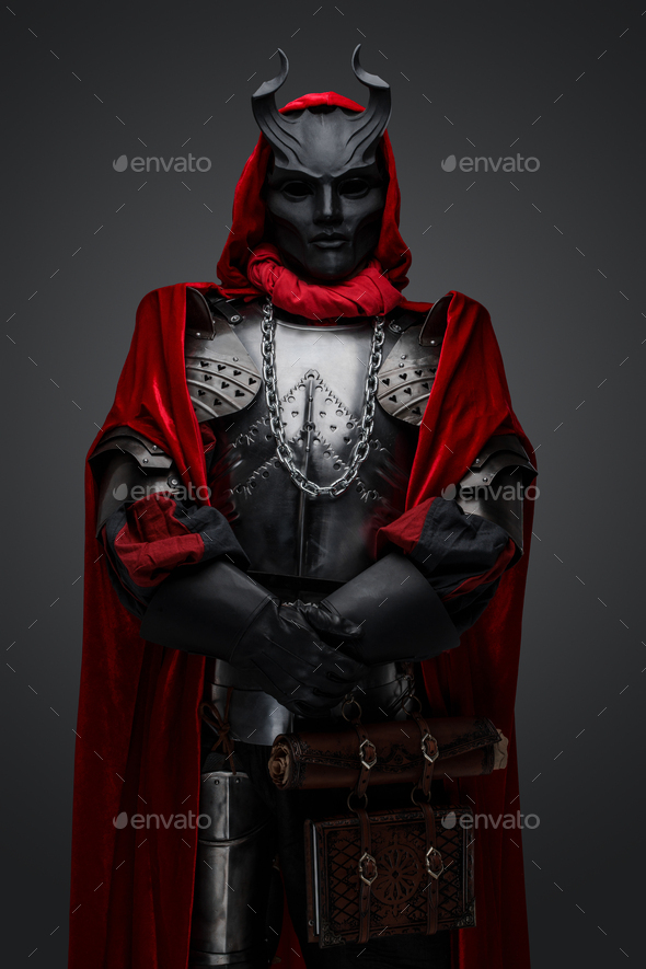 Mystic member of cult with black mask and red cloak Stock Photo by fxquadro