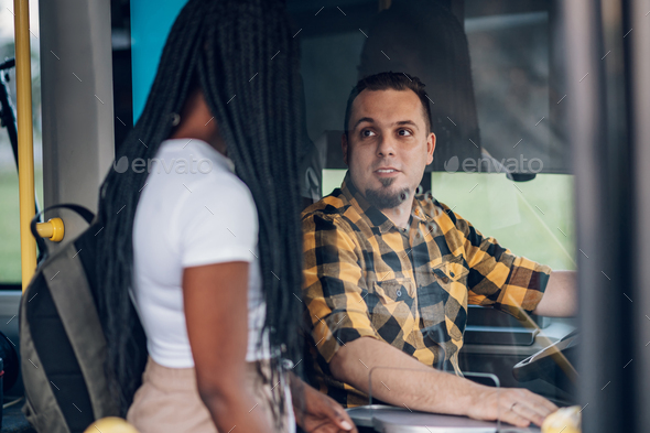 Bus driver behind the wheel of a public transport vehicle Stock Photo ...