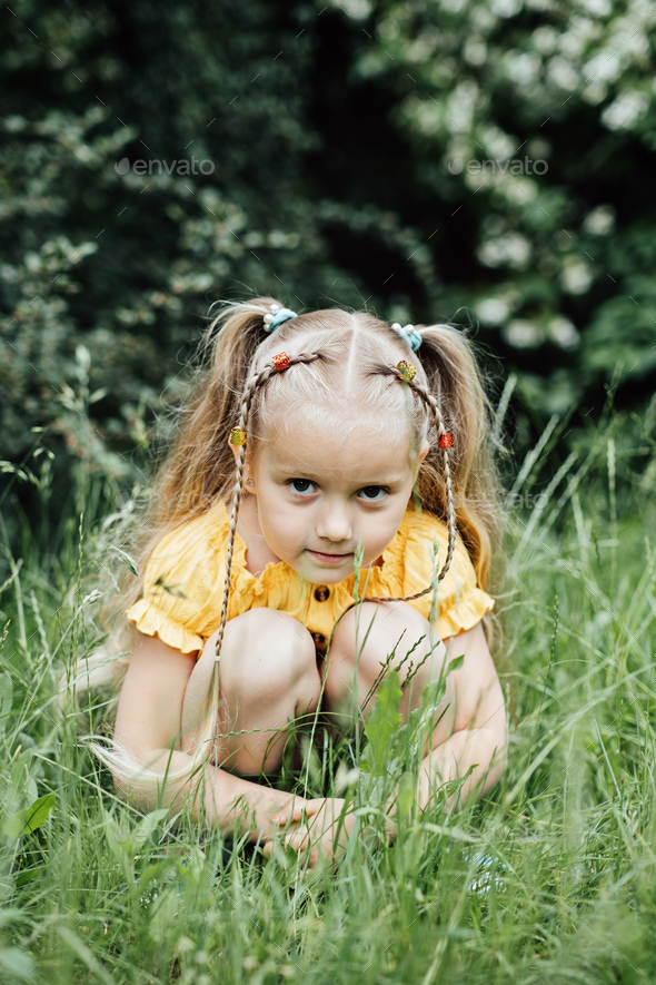 Summer activities and connecting with nature for kids. Cute little girl ...