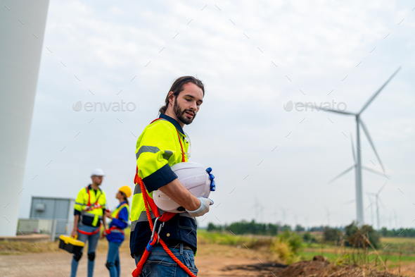 Wind turbine maintenance engineer at wind farm construction site. Stock ...