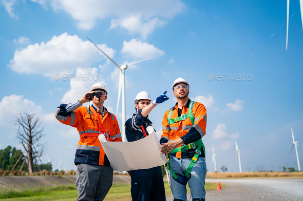 Wind turbine maintenance engineer at wind farm construction site. Stock ...