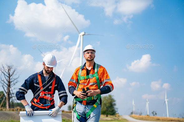 Wind turbine maintenance engineer at wind farm construction site. Stock ...