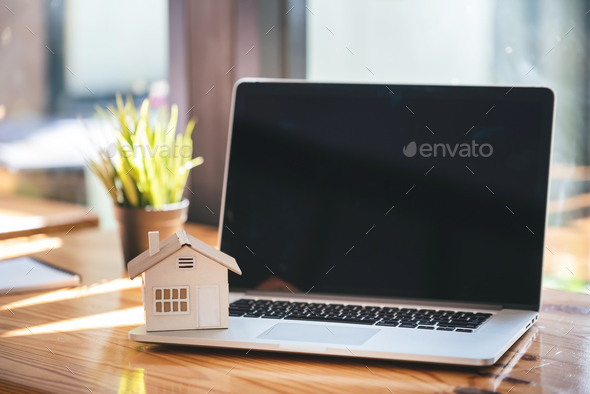 Real estate ideas with house designs placed on computers Stock Photo by ...