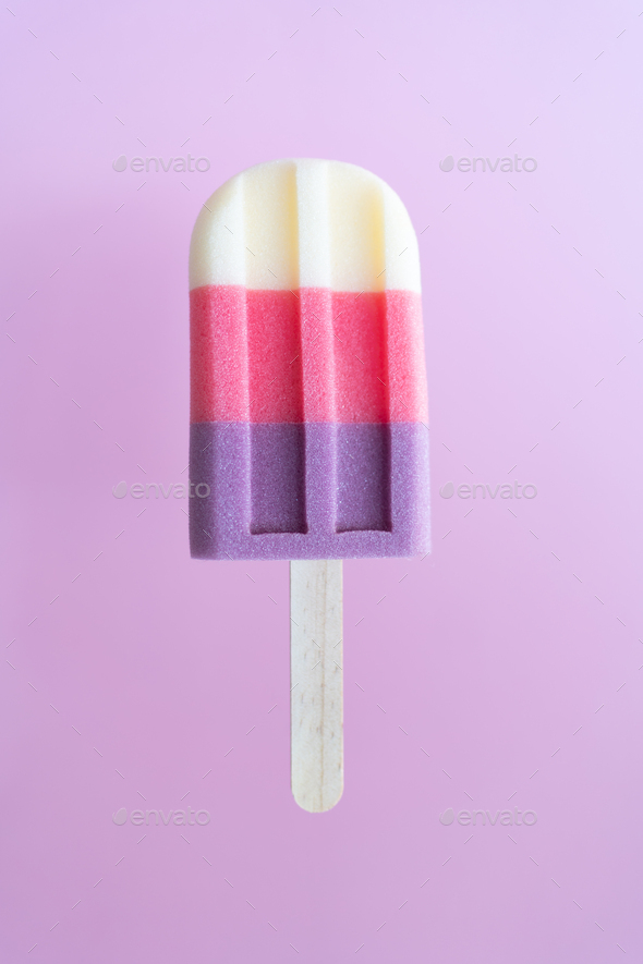 Colored ice cream popsicle on a pastel purple background. Minimal ...