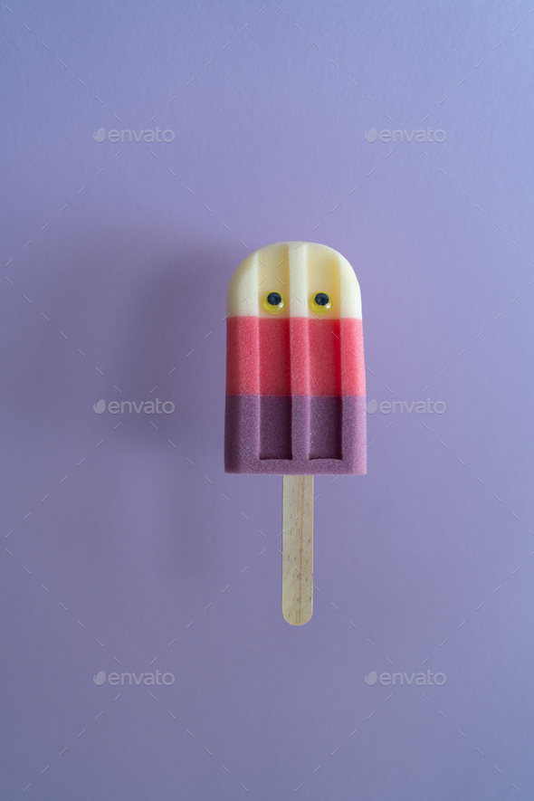 Colored ice cream popsicle on a pastel purple background. Minimal ...