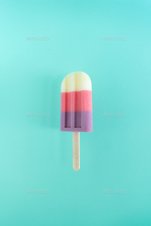 Colored ice cream popsicle on mint background. Minimal summer concept ...