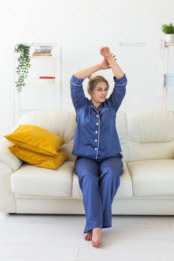 Glamorous woman wears pajama with happy smile chilling in good morning ...