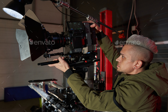 film set with a professional film camera installed on a camera operator ...