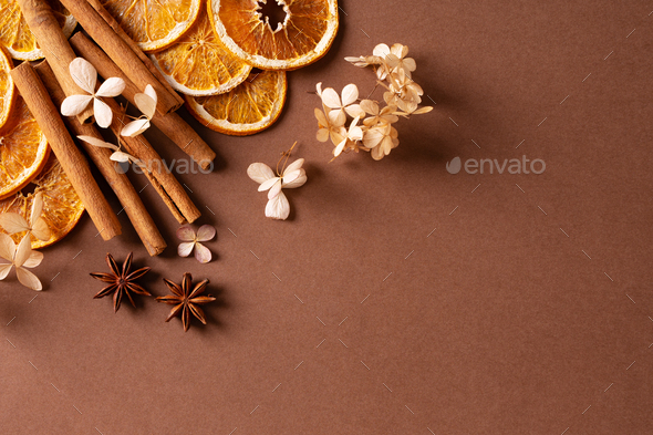 Autumn spice and flowers frame, border on brown background Stock Photo ...