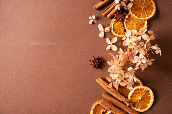 Autumn spice and flowers frame, border on brown background Stock Photo ...