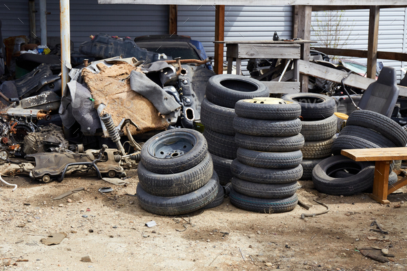 Old used car tires at a junkyard. Rubber tire recycling. Stock Photo by ...