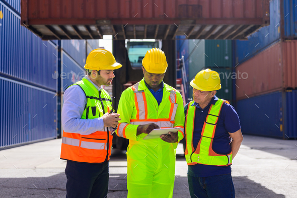 Warehouse engineer worker checking and working at industrial container ...