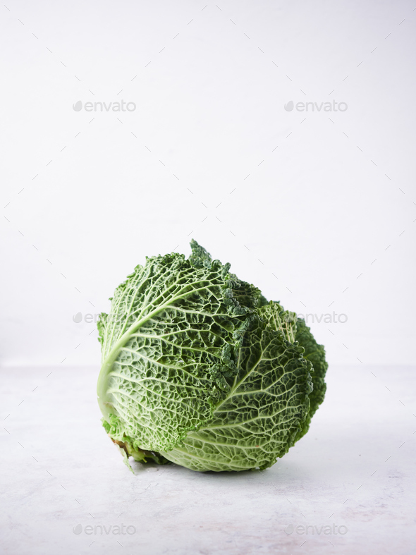 raw cabbage with closed leaves isolated on light grey surface and ...