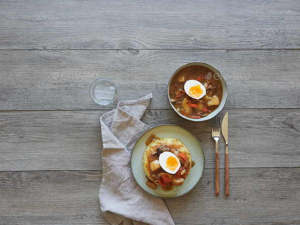 view from above of a food table with plates of mushroom stew Stock ...