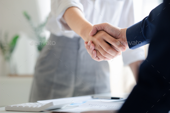 Business investor group holding hands, Two businessmen are agreeing on ...