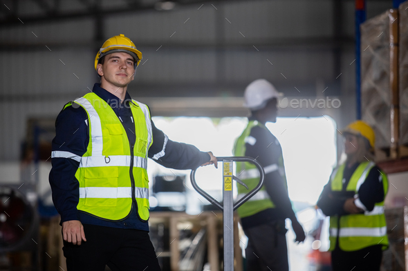 Warehouse industrial stock storage, man worker wear safety uniform push ...