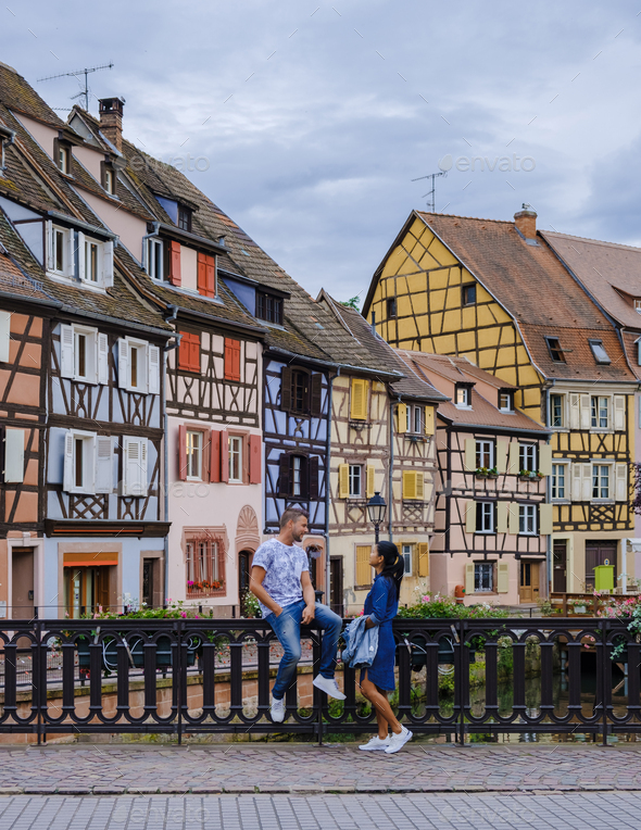Colmar, Alsace, France Petite Venice, couple visit the traditional half ...