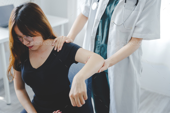 Physical therapist giving dumbbell exercises about the arms and ...