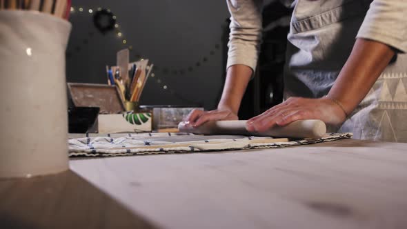 Pottery in the Studio Young Woman Flattening Clay Using a Rolling Pin ...