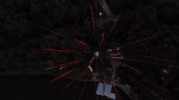 Drone flying over large exploding mortar fireworks being shot over a ...