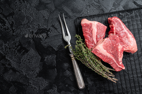 Topside sirloin beef cut, raw meat with spices. Black background. Top ...