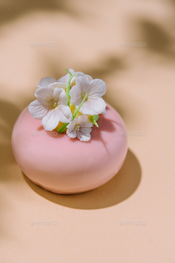 Pink mousse cake with mirror glaze decorated with flowers Stock Photo ...