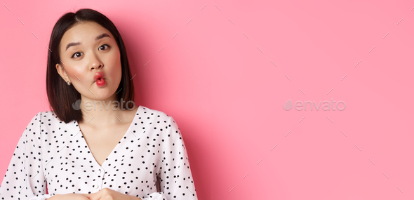 Beauty and lifestyle concept. Close-up of funny and cute asian woman ...