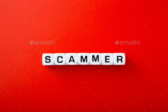 White block with scammer word Stock Photo by tehcheesiong | PhotoDune