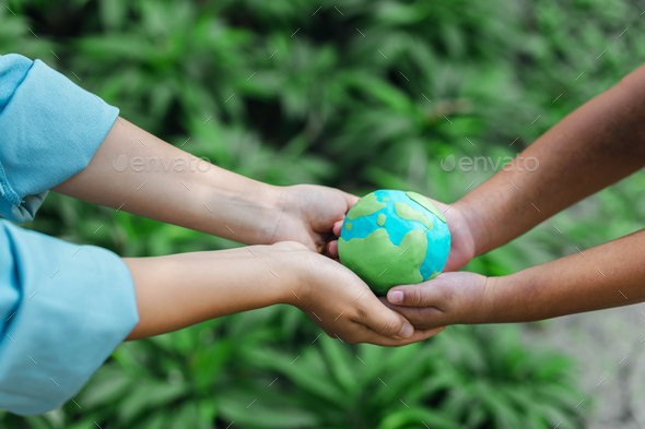 two people holding environmental protection concept green earth earth ...