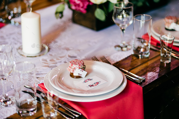 Glassware and cutlery for event dinner. Festive table with plates forks ...