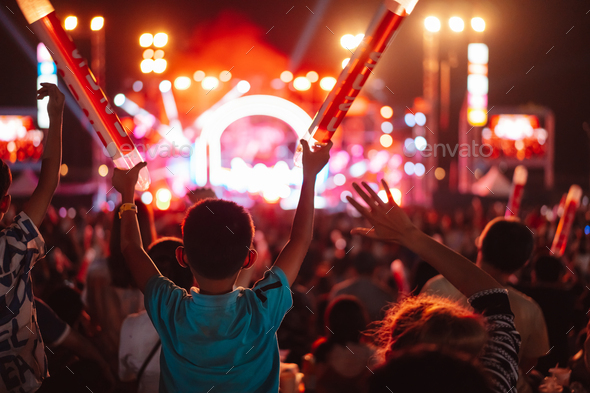 Crowd of hands up concert stage lights and people fan audience ...