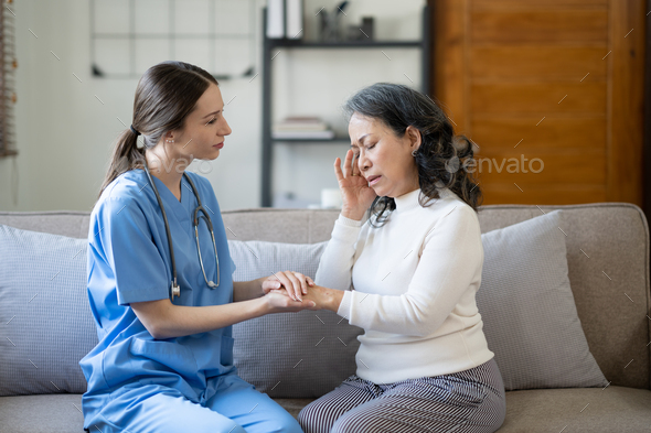 Female doctor holding female patient hands with compassion and comfort ...